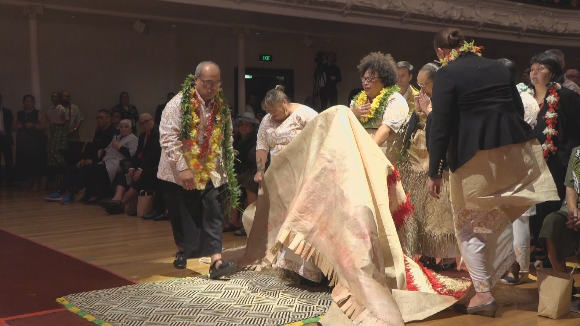 Mat draped over Ardern as part of Govt's formal apology for dawn raids